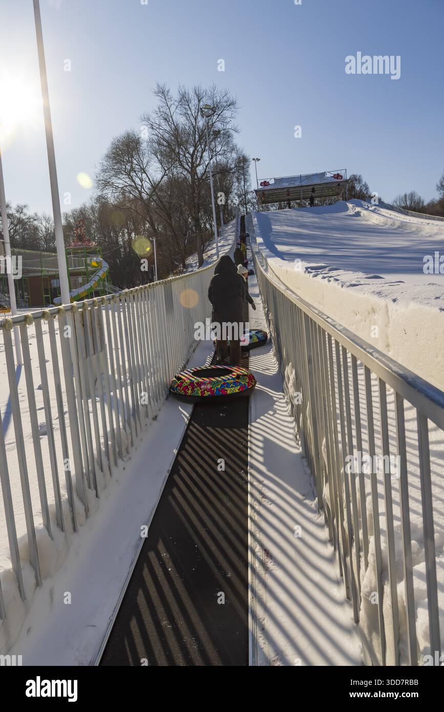 People enjoy snow fun at a ski resort in Jilin City, northeast China's ...