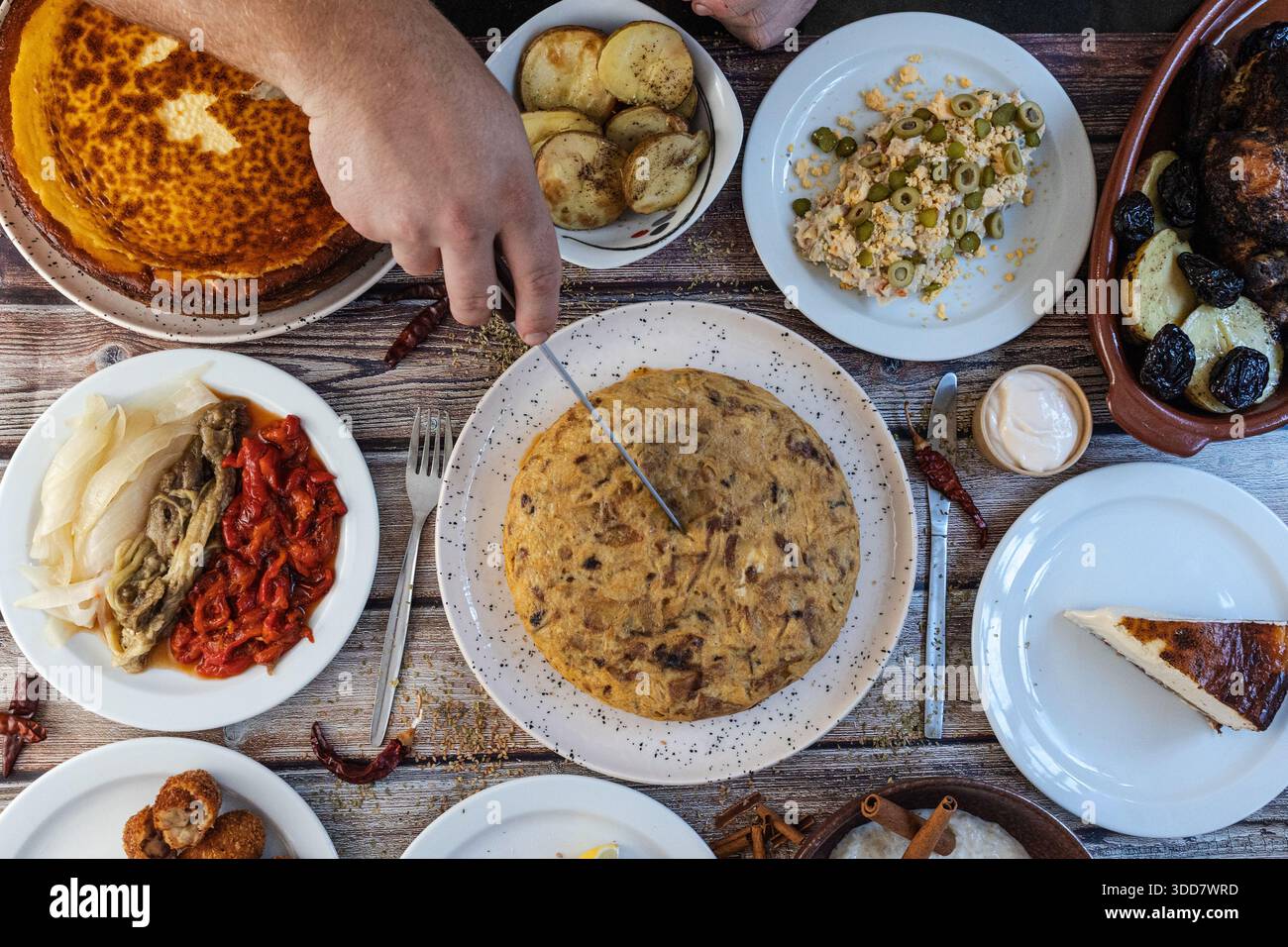 Person serving authentic spanish and mediterranean appetizers for a ...