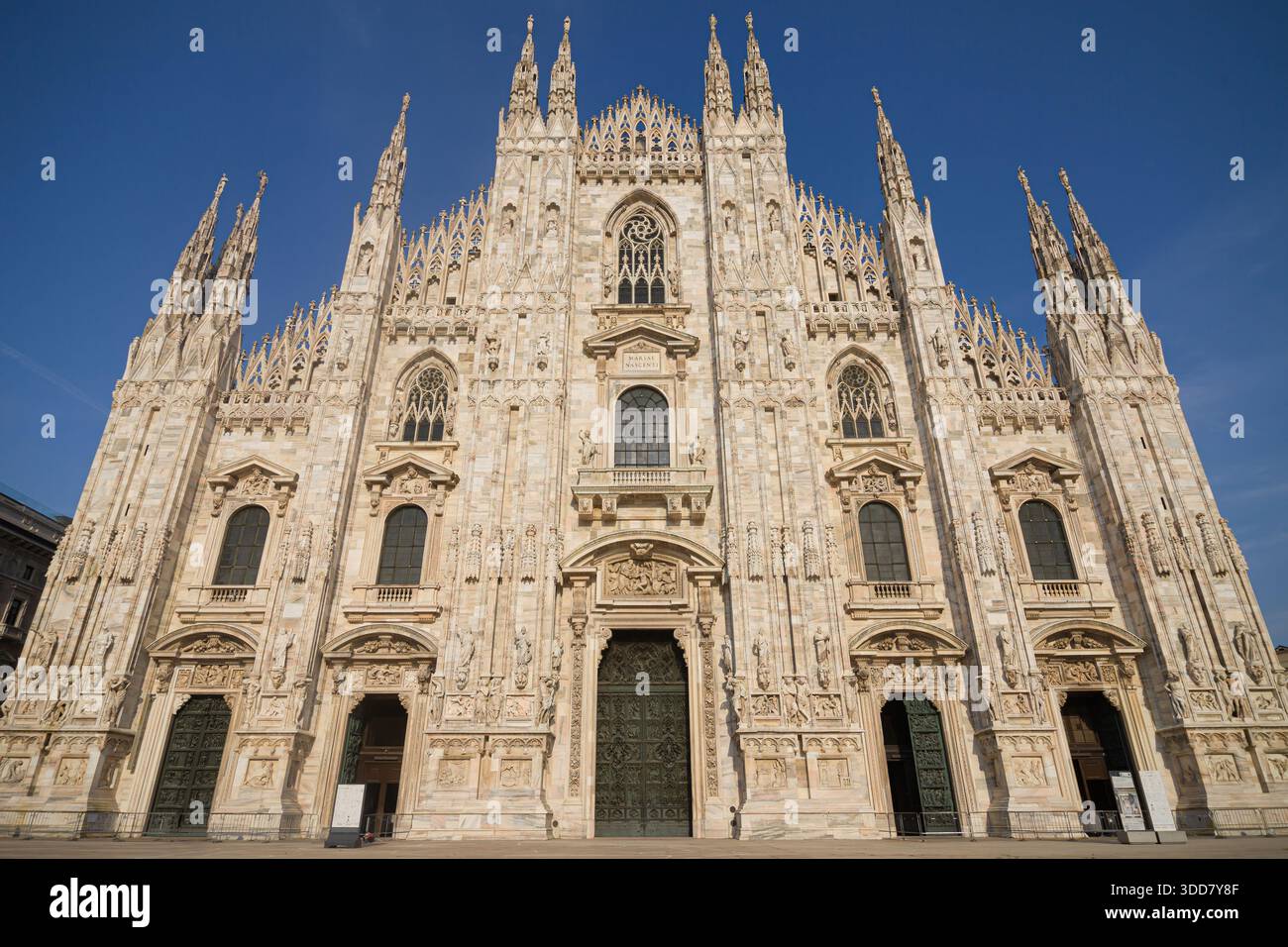 Duomo of Milan seen from a low angle, highlighting towering spires ...