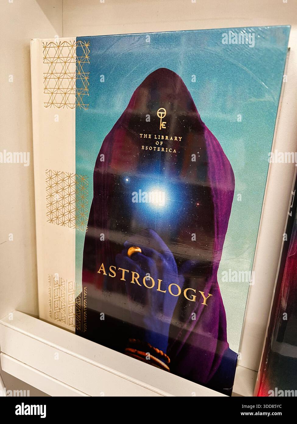 London, UK - December 12, 2025: Astrology book with a mystical purple ...