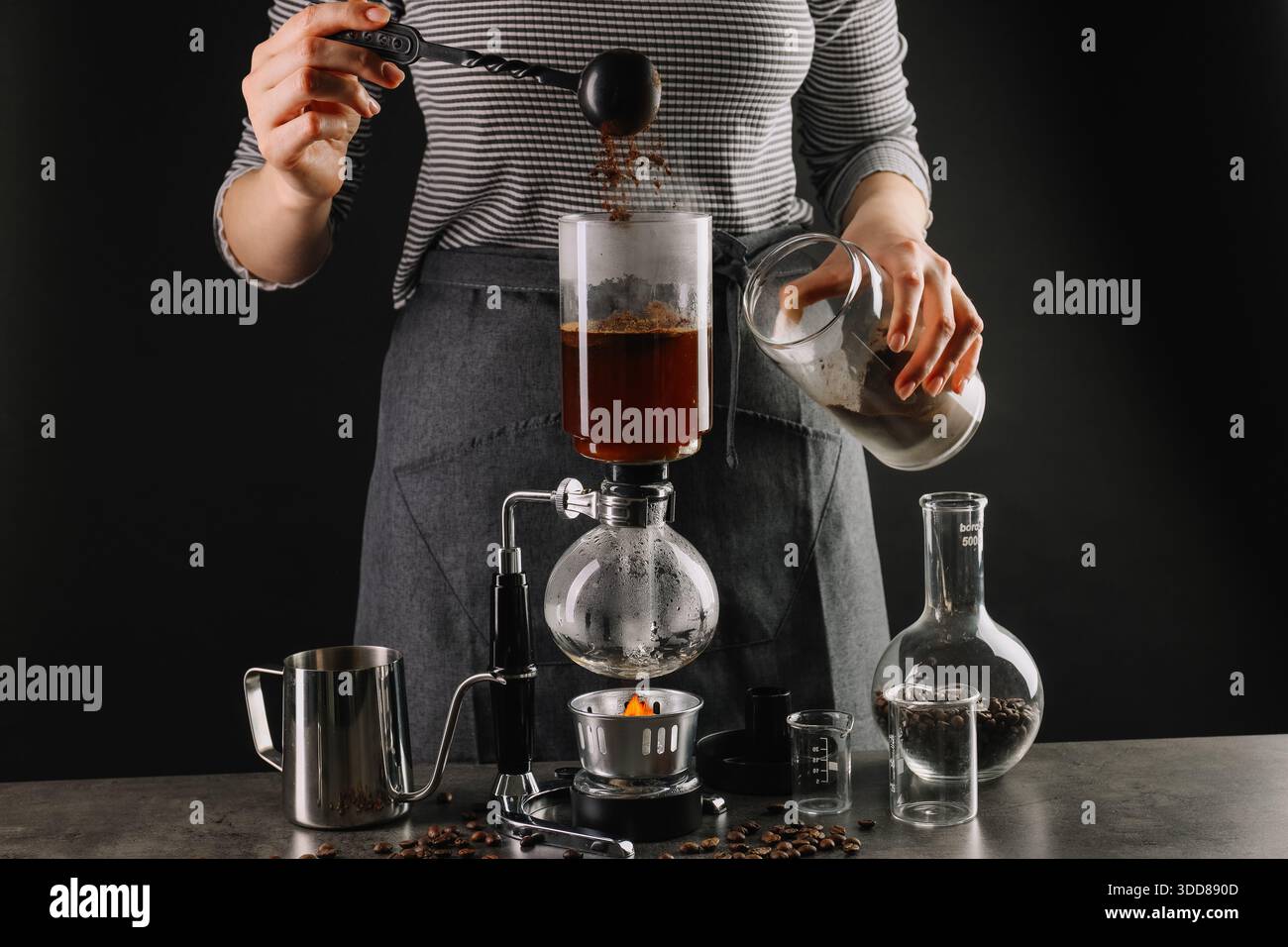 Woman brewing coffee vacuum hi-res stock photography and images - Alamy