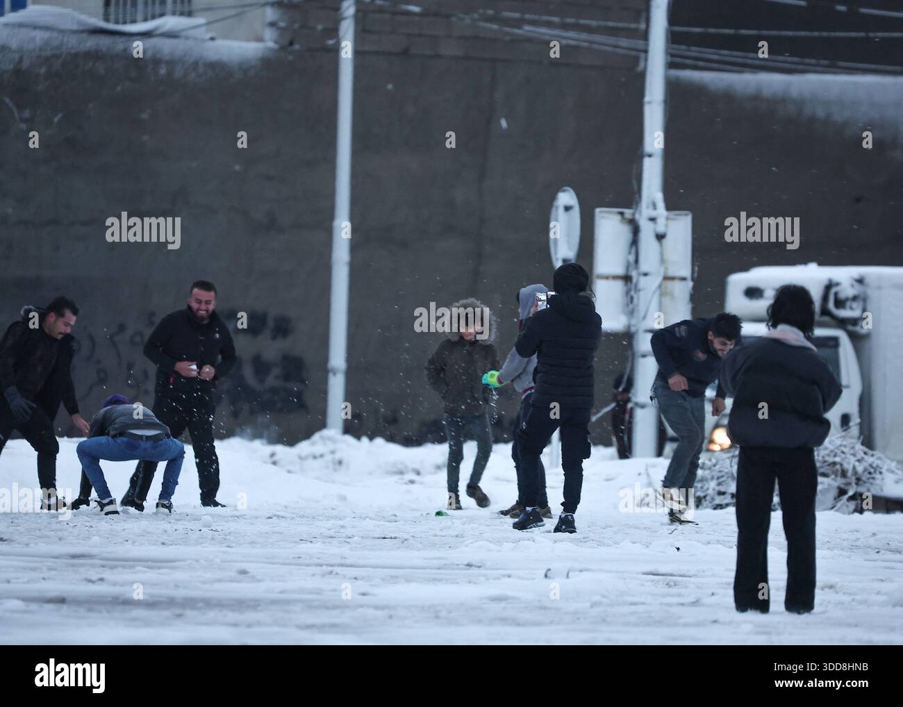 Residents of Baharka district celebrate the first significant snowfall ...
