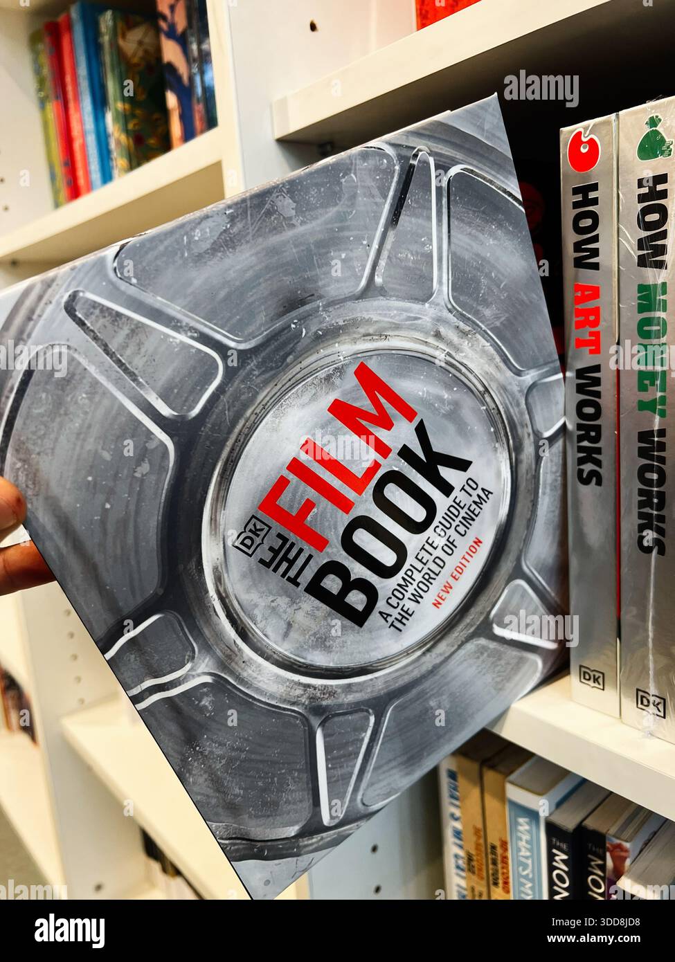 London, UK - December 12, 2025: A large film reel book cover on a shelf ...