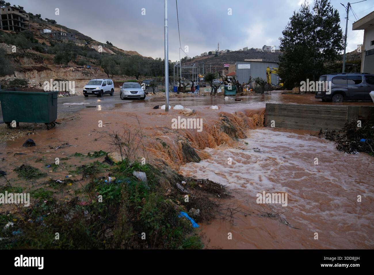 Rain floods storm the streets during a powerful winter system that ...