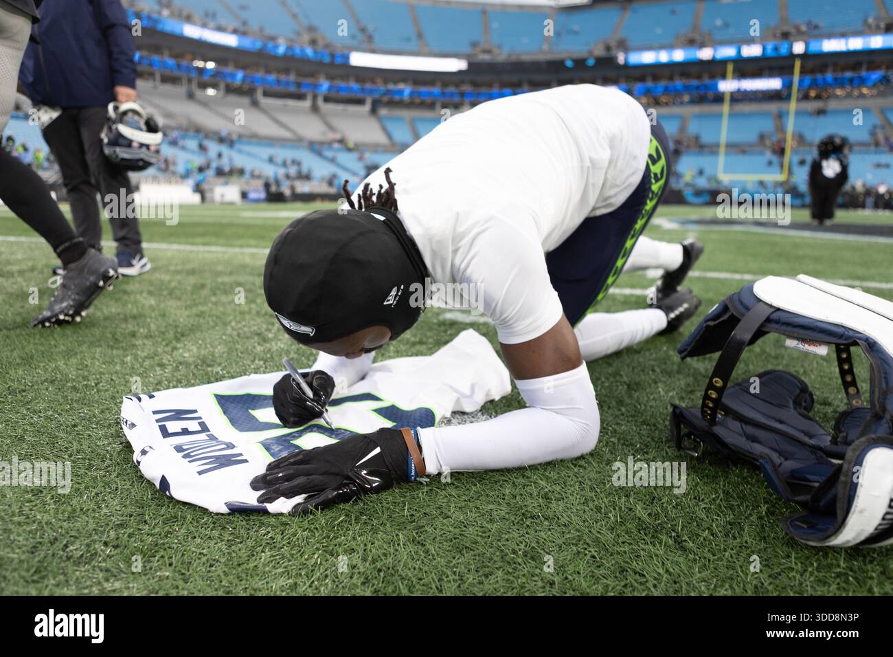 Seattle Seahawks cornerback Riq Woolen (27) signs his jersey at Bank of ...