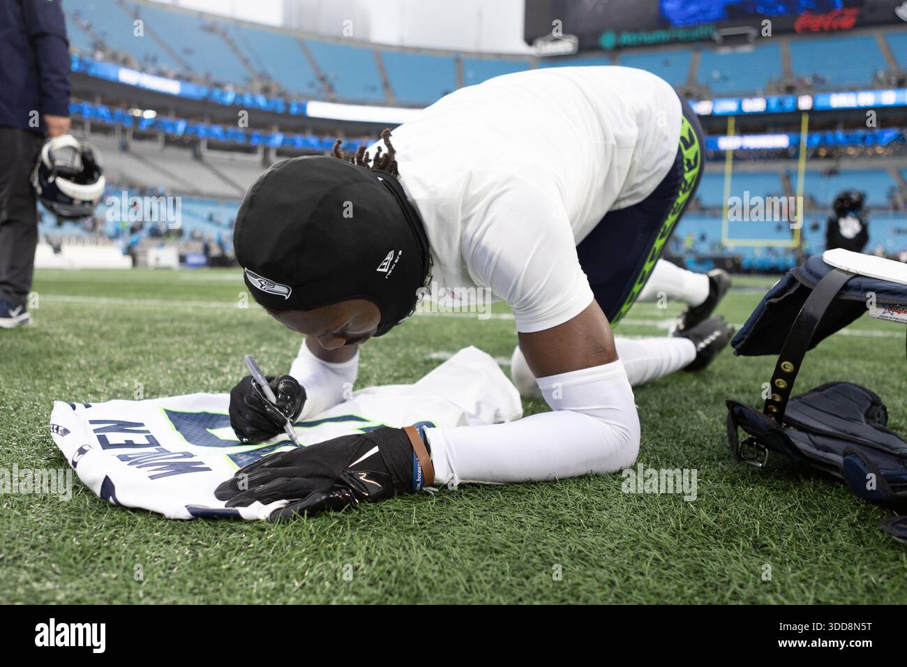 Seattle Seahawks cornerback Riq Woolen (27) signs his jersey at Bank of ...