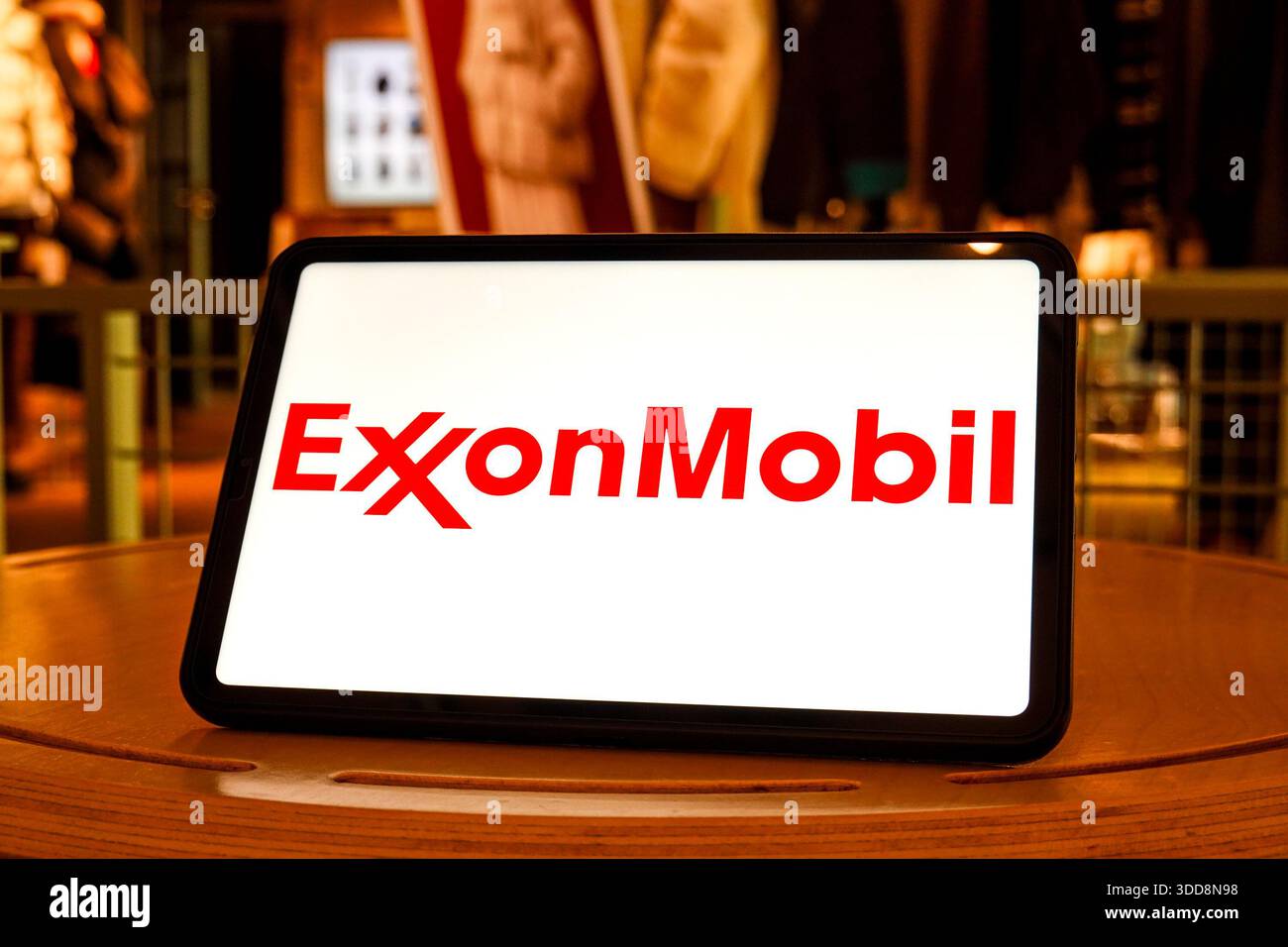 In this photo illustration, the logo of ExxonMobil is seen displayed on ...