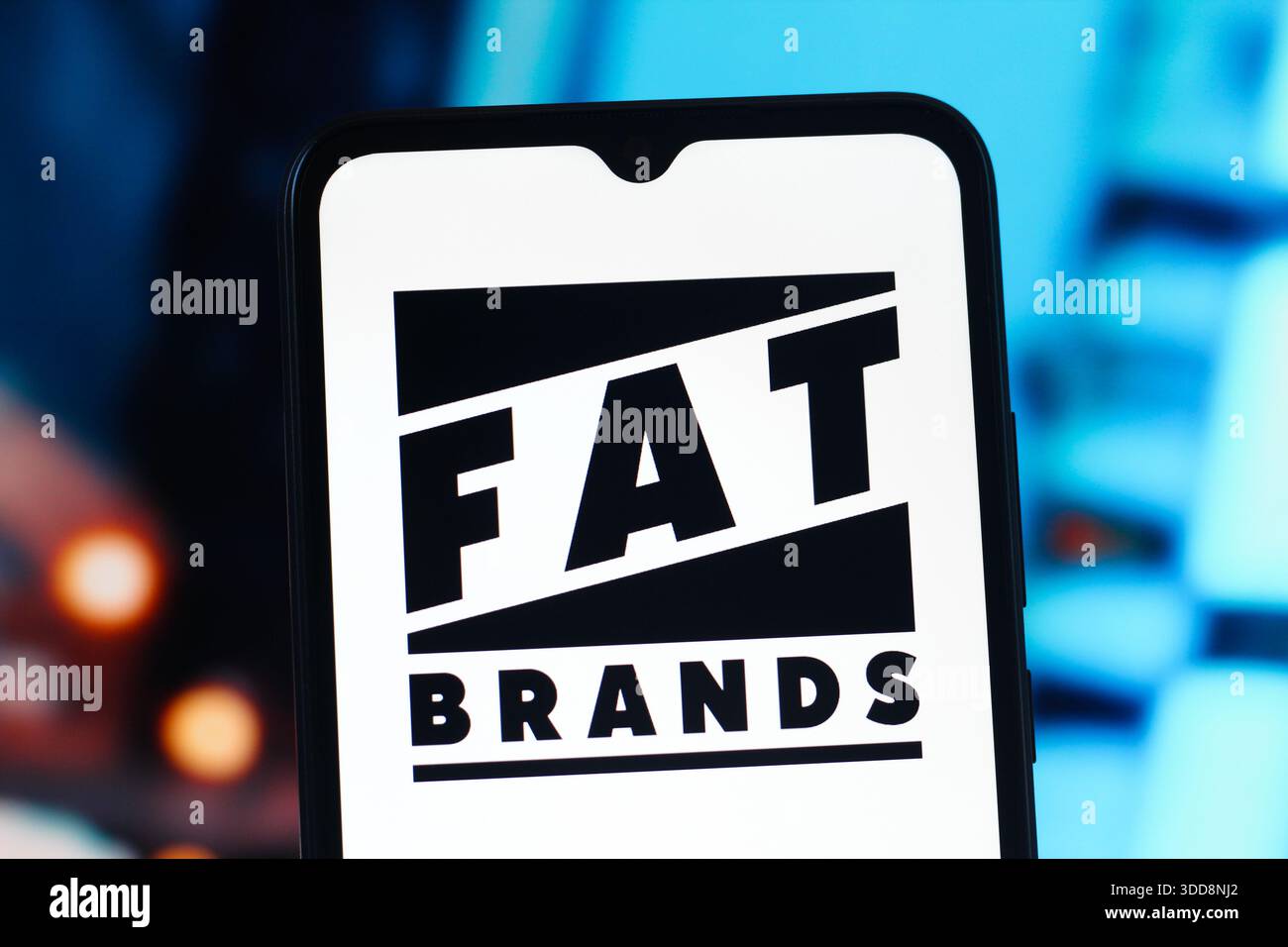 In this photo illustration, the FAT Brands logo is seen displayed on a ...