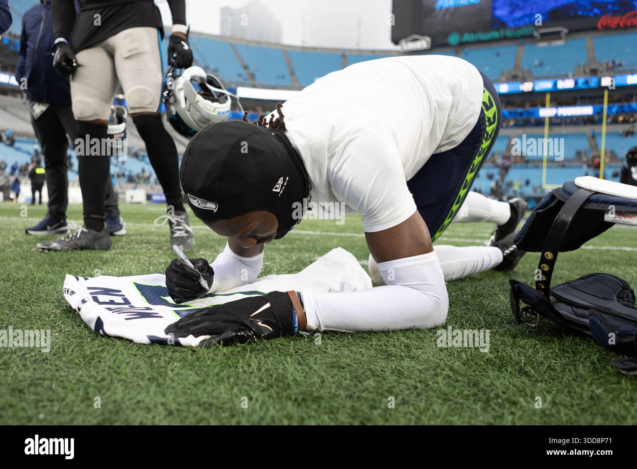Seattle Seahawks cornerback Riq Woolen (27) signs his jersey at Bank of ...