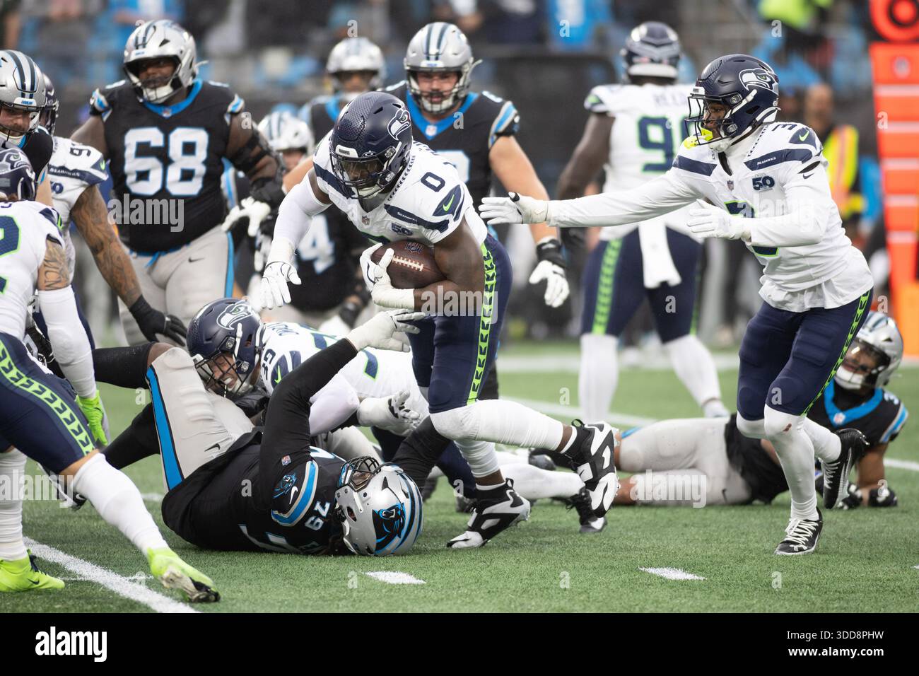 Seattle Seahawks defensive end Demarcus Lawrence (0) gets the ball ...