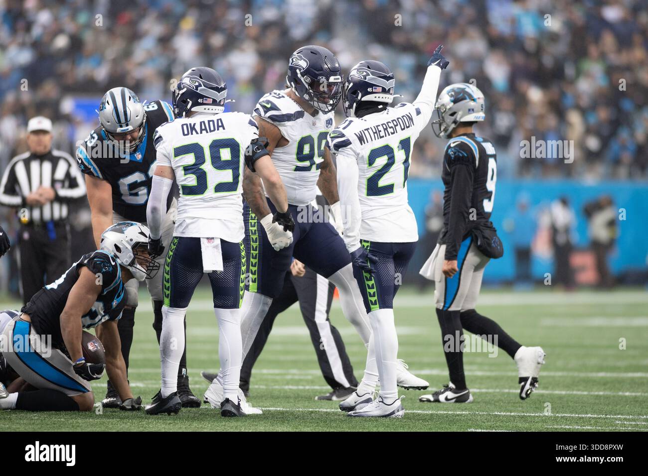 Seattle Seahawks defensive end Leonard Williams (99), cornerback Devon ...