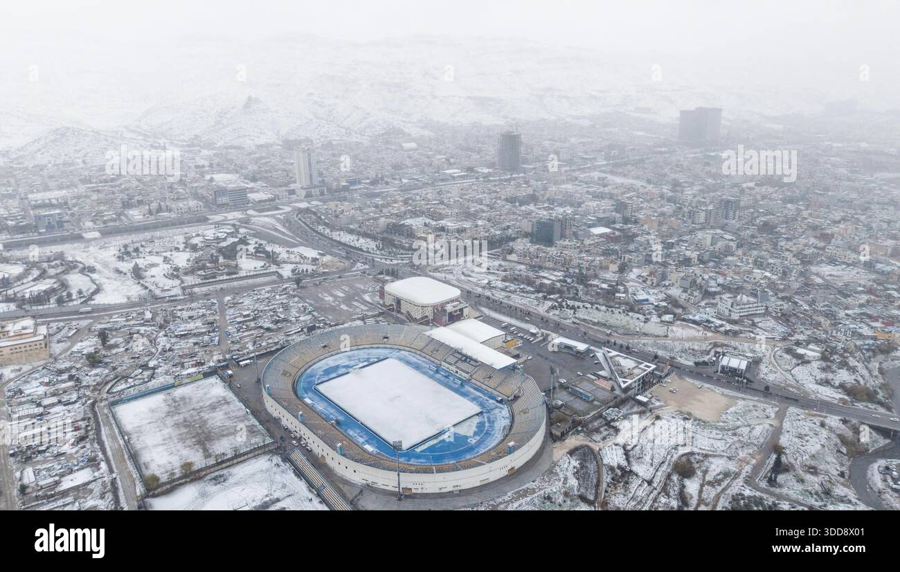 Aerial view shows the Duhok Stadium and the surrounding city center ...