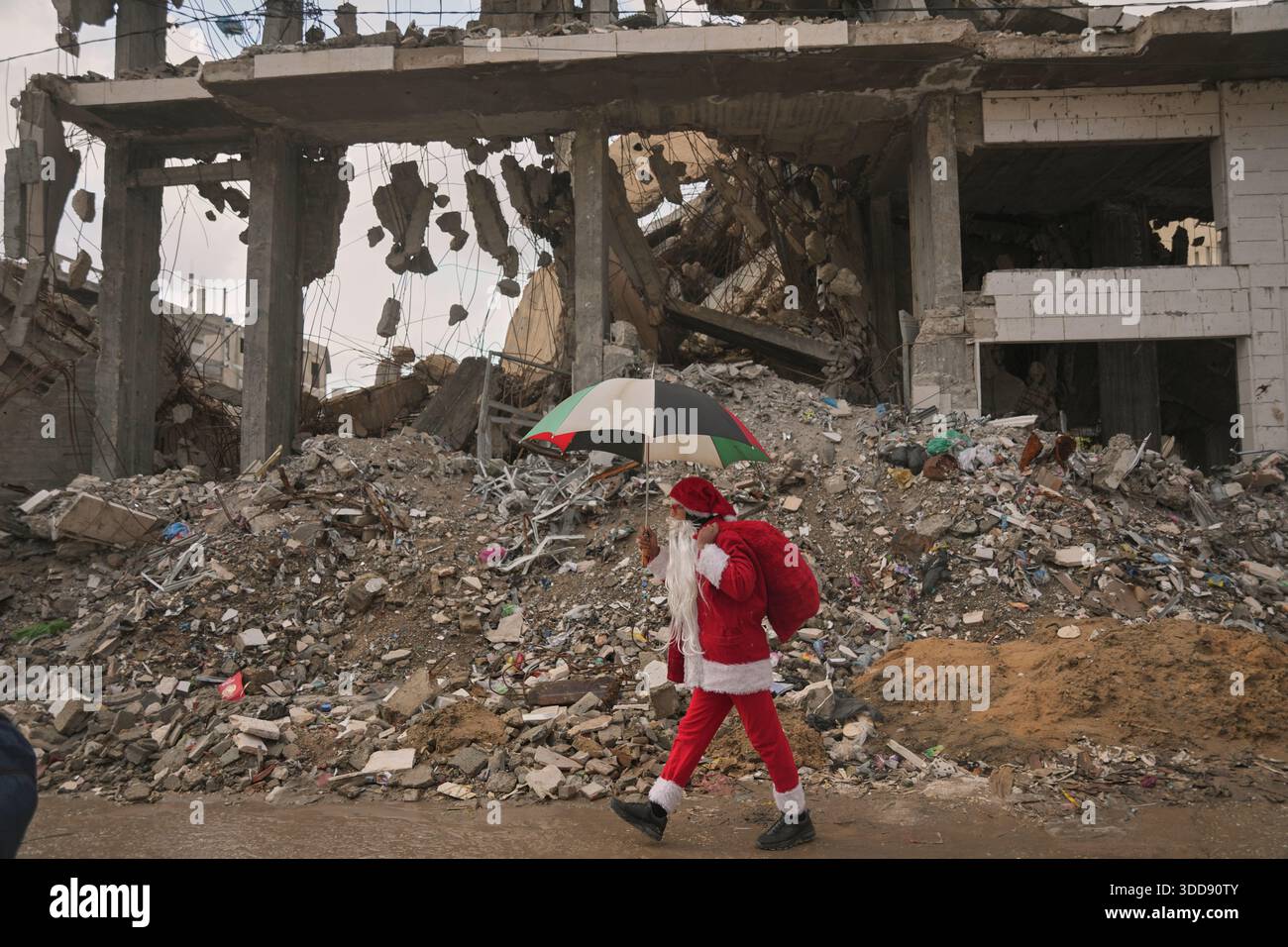Wearing a Santa Claus costume, Palestinian clown Murad Murad, 38, walks ...
