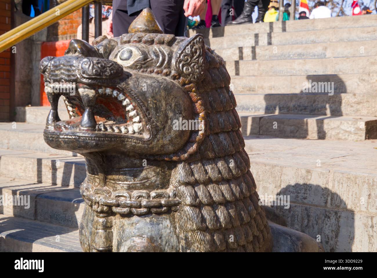 Detailed stone lion statue on the steps of a traditional temple ...
