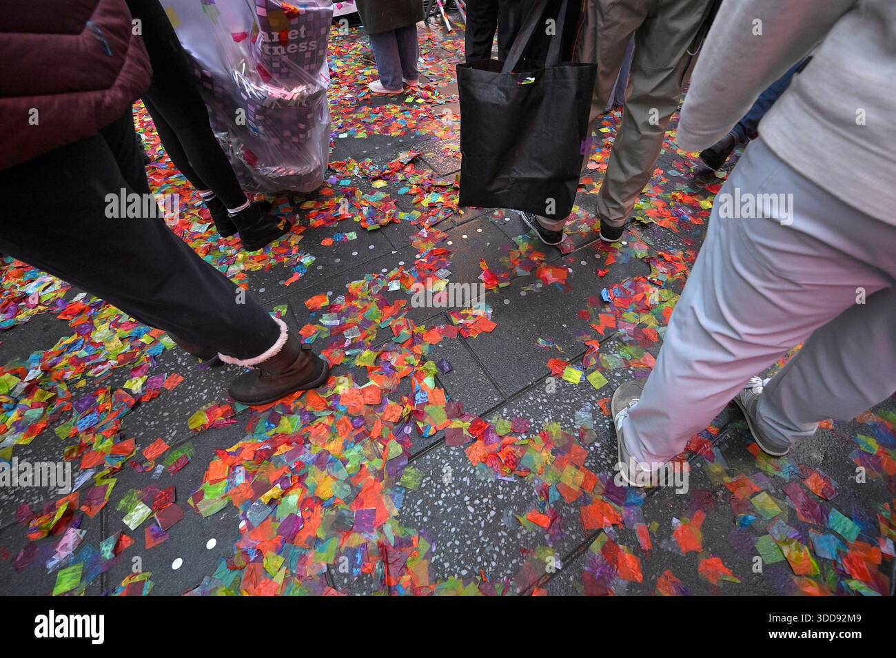 Wet confetti decorates the ground in Times Square during the New Year's ...