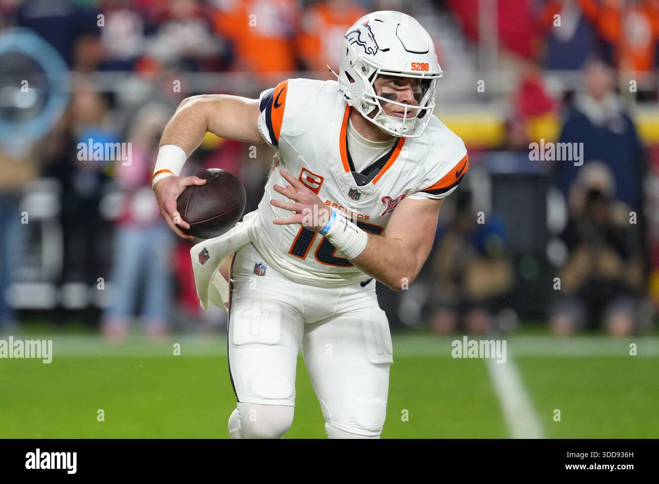 Denver Broncos quarterback Bo Nix runs during an NFL football game ...