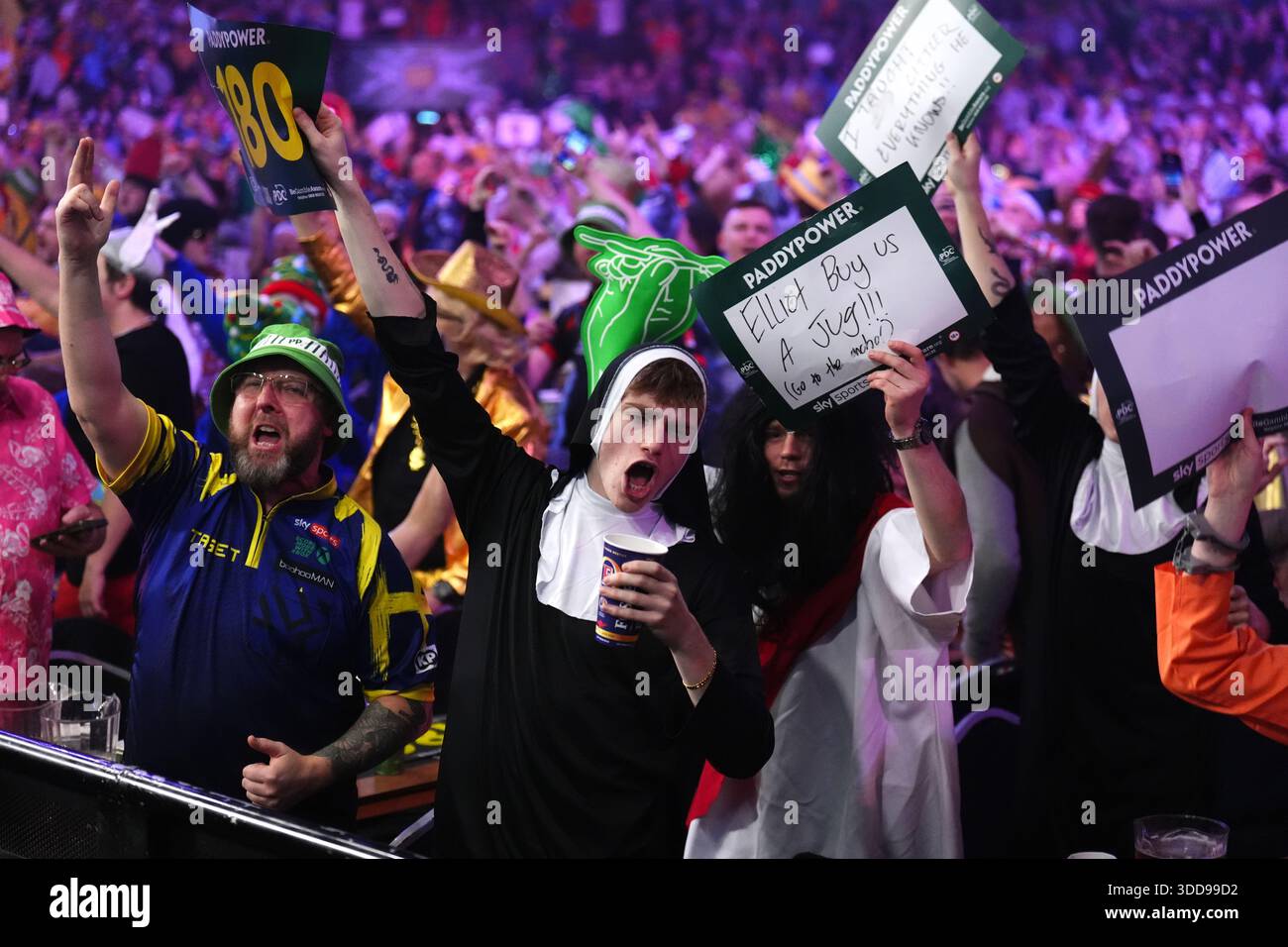 Spectators in fancy dress on day sixteen of the Paddy Power World Darts ...