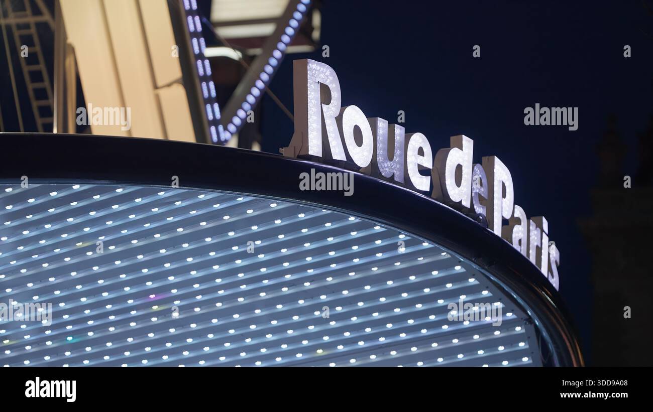 PARIS, FRANCE - DECEMBER 16, 2025 - Roue de Paris attraction glows ...