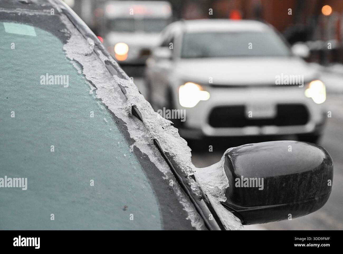 Ice covers the windscreen of a car in Montreal, Monday, Dec. 29, 2025 ...