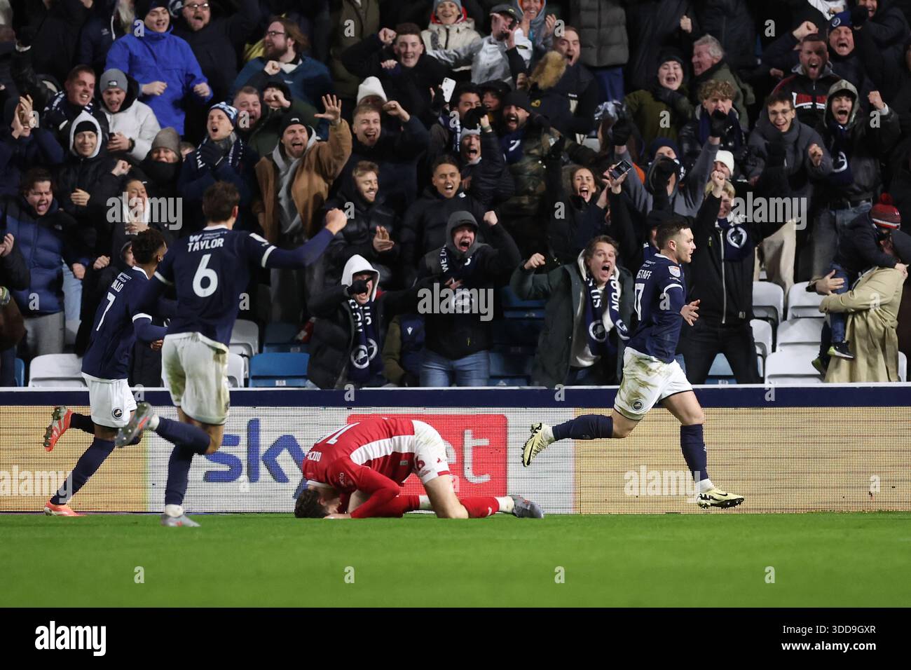 Millwall's Macaulay Langstaff (right) celebrates scoring their side's ...