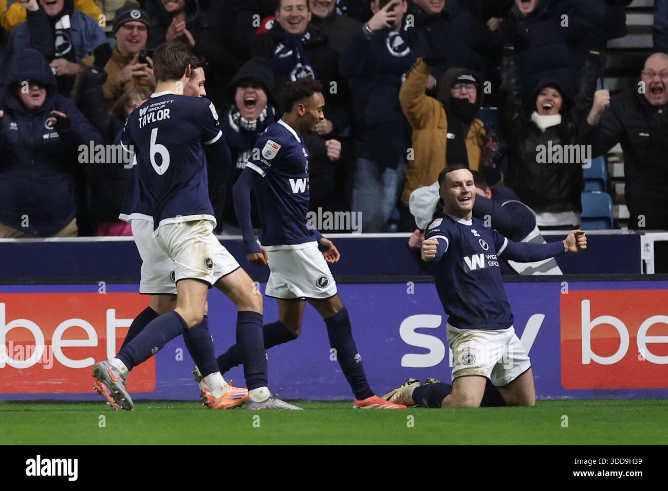 Millwall's Macaulay Langstaff (right) celebrates scoring their side's ...