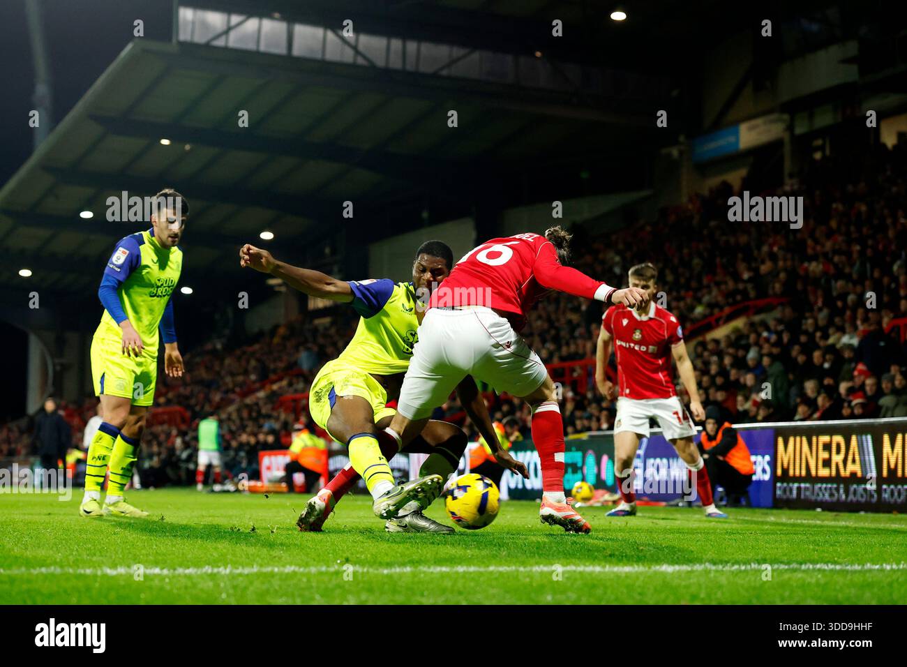 Wrexham's Jay Rodriguez (centre right) is tackled by Preston North End ...