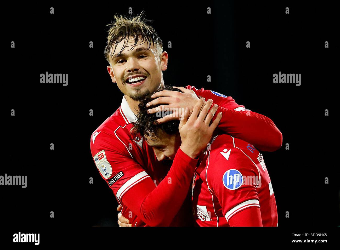 Wrexham's Callum Doyle (left) and Ollie Rathbone celebrate after the ...
