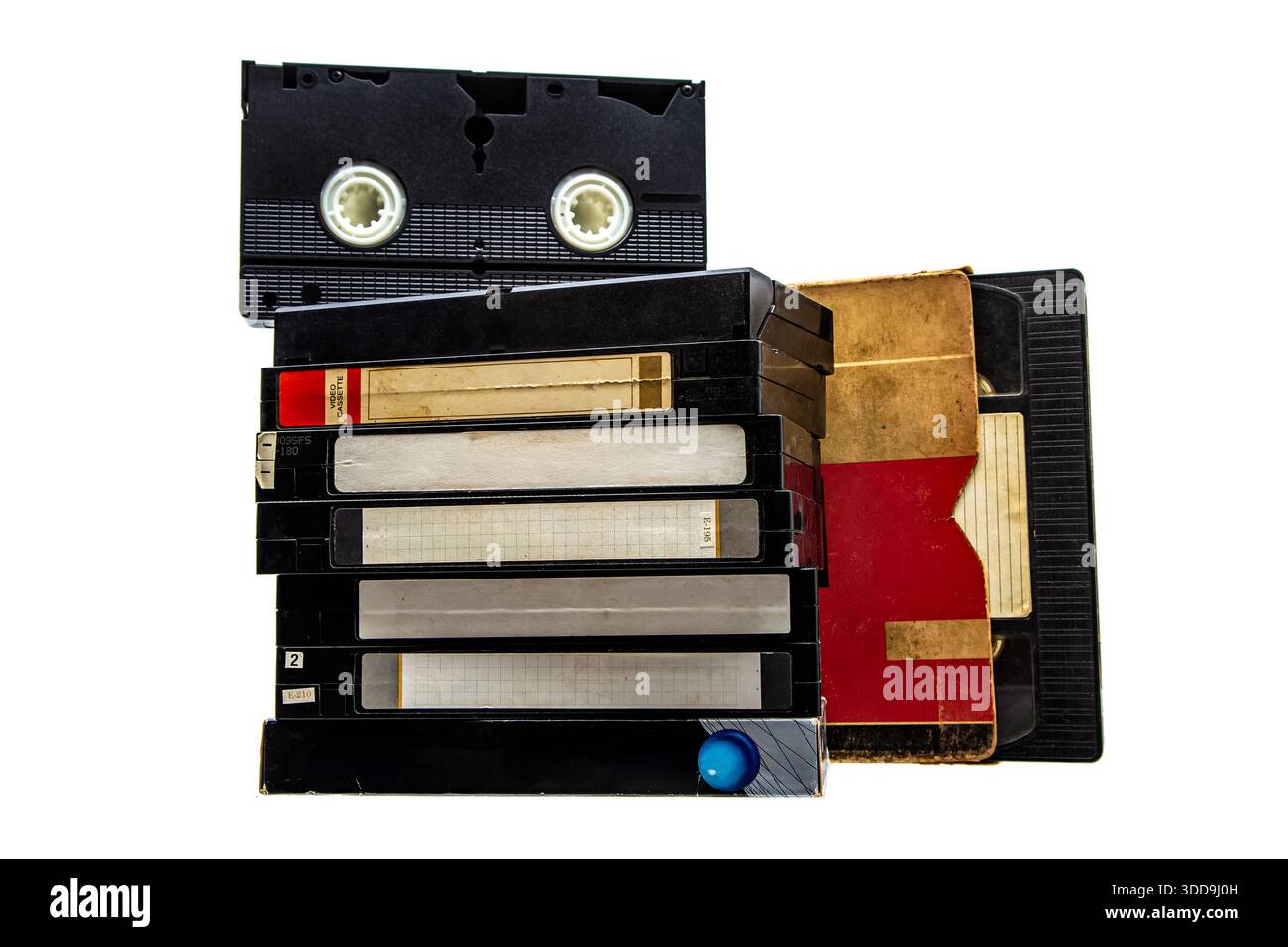 Stack of old VHS video cassette tapes with blank labels isolated on a ...