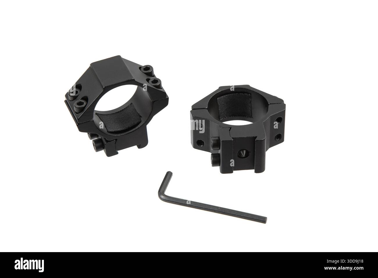 Black tactical rifle scope rings with allen key tool on a white ...