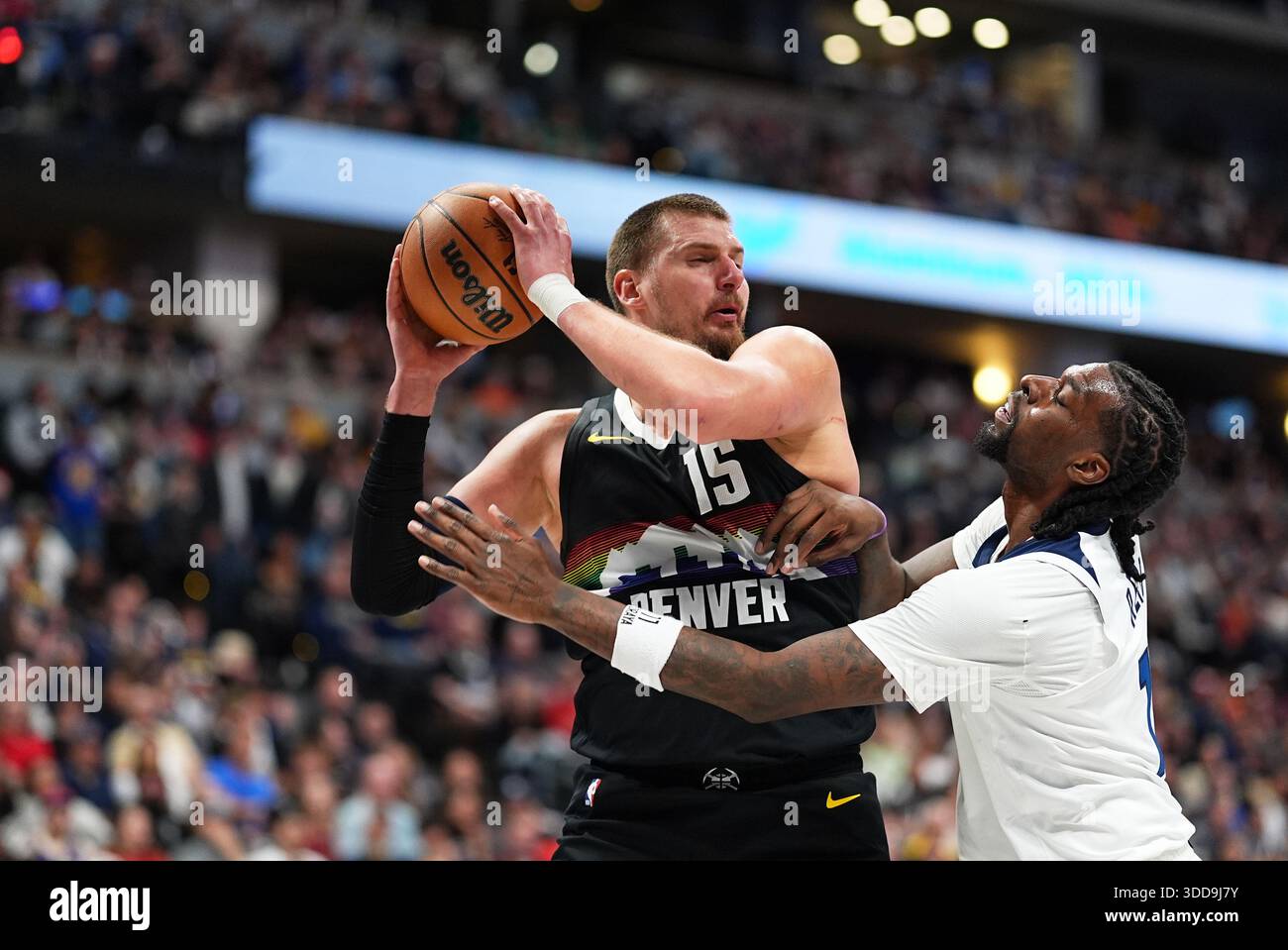 Denver Nuggets center Nikola Jokić (15) and Minnesota Timberwolves ...