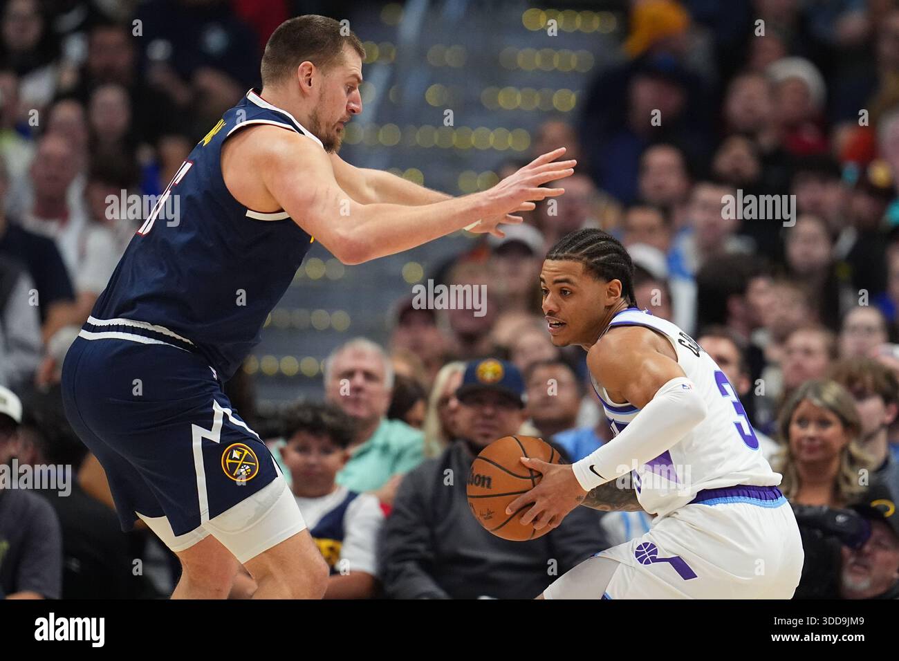Denver Nuggets center Nikola Jokić (15) and Utah Jazz guard Keyonte ...