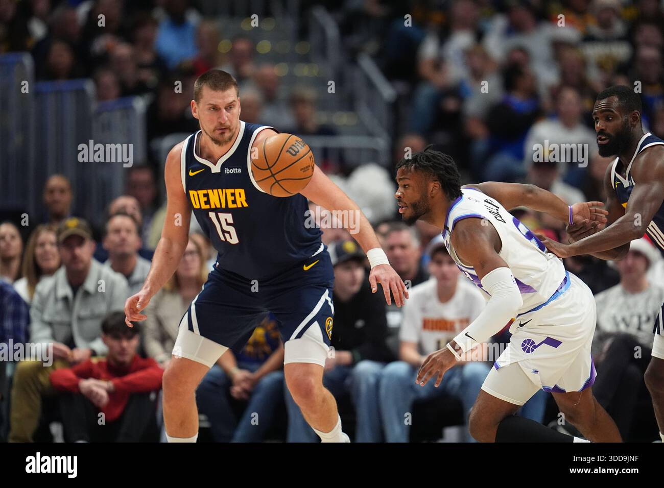 Denver Nuggets center Nikola Jokić (15) and Utah Jazz guard Isaiah ...