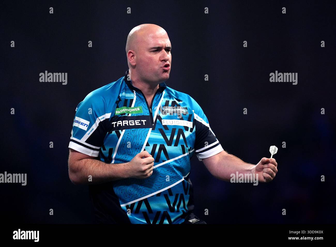 England's Rob Cross celebrates a second set during his match against ...