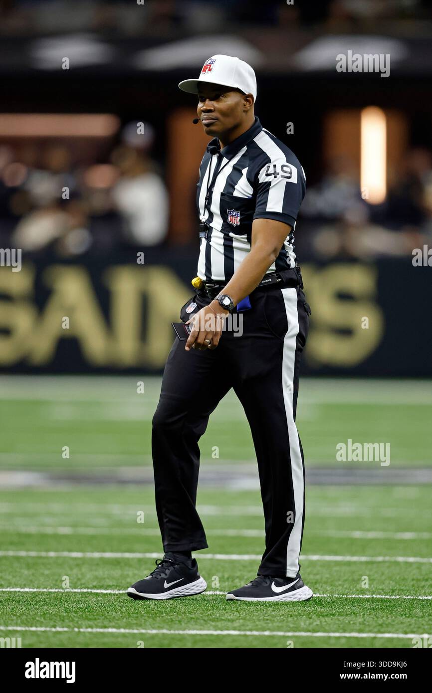 Referee Alex Moore (49) works during an NFL football game between the ...