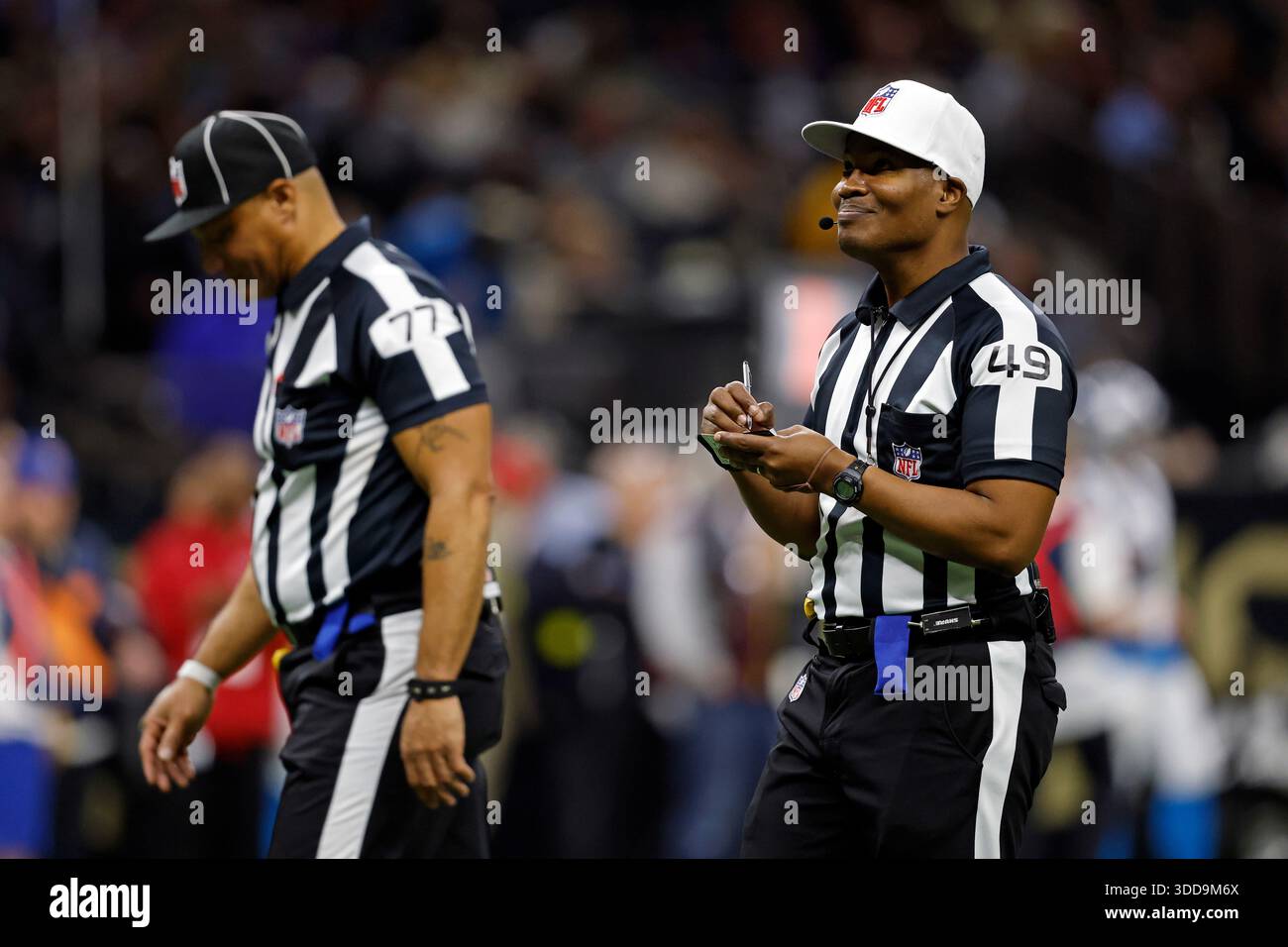 Referee Alex Moore (49) works during an NFL football game between the ...