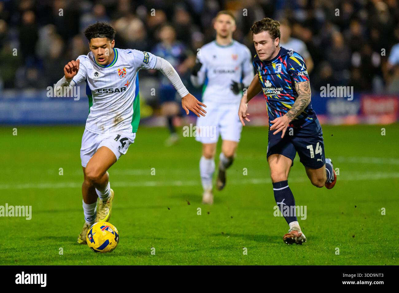 Charlie McCann of Barrow FC chases Jayden Joseph of Tranmere Rovers FC ...
