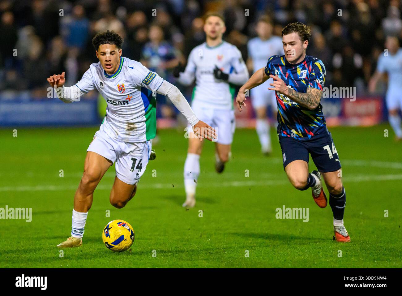 Charlie McCann of Barrow FC chases Jayden Joseph of Tranmere Rovers FC ...