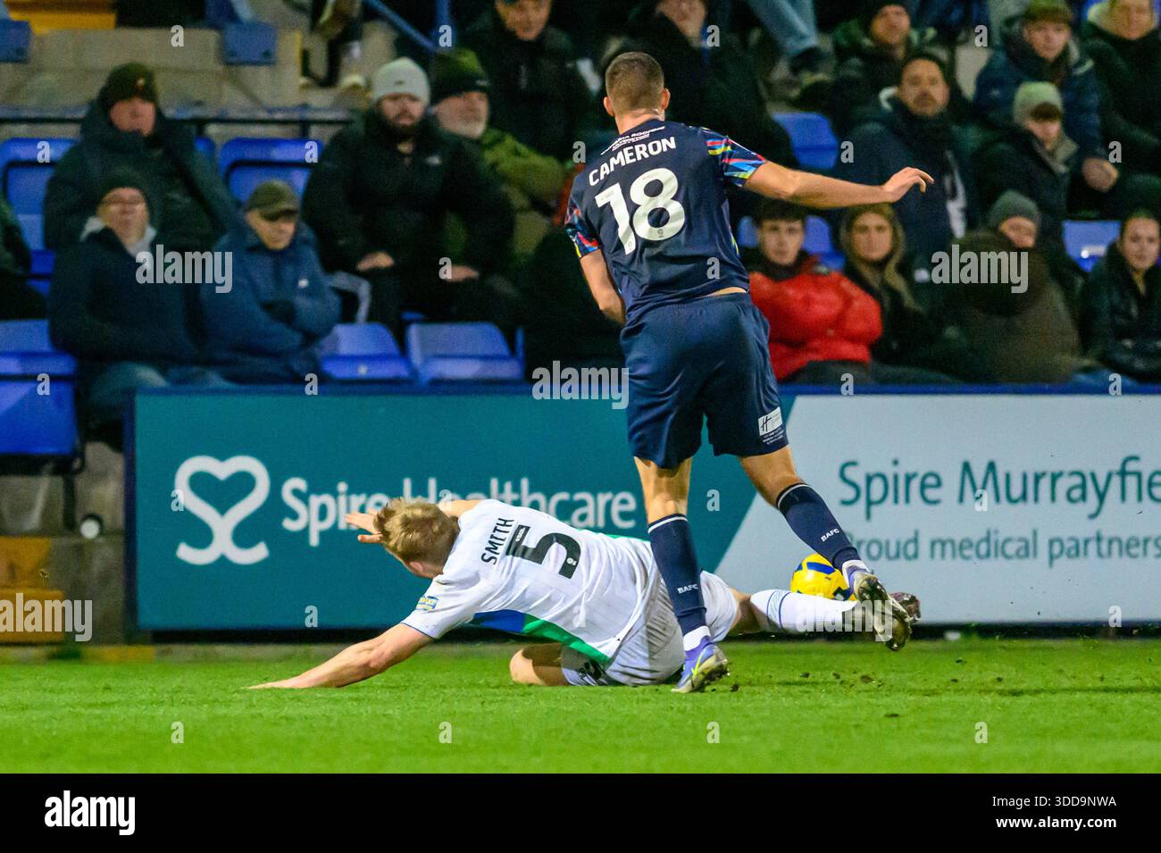 Innes Cameron of Barrow FC tries to avoid Nathan Smith of Tranmere ...