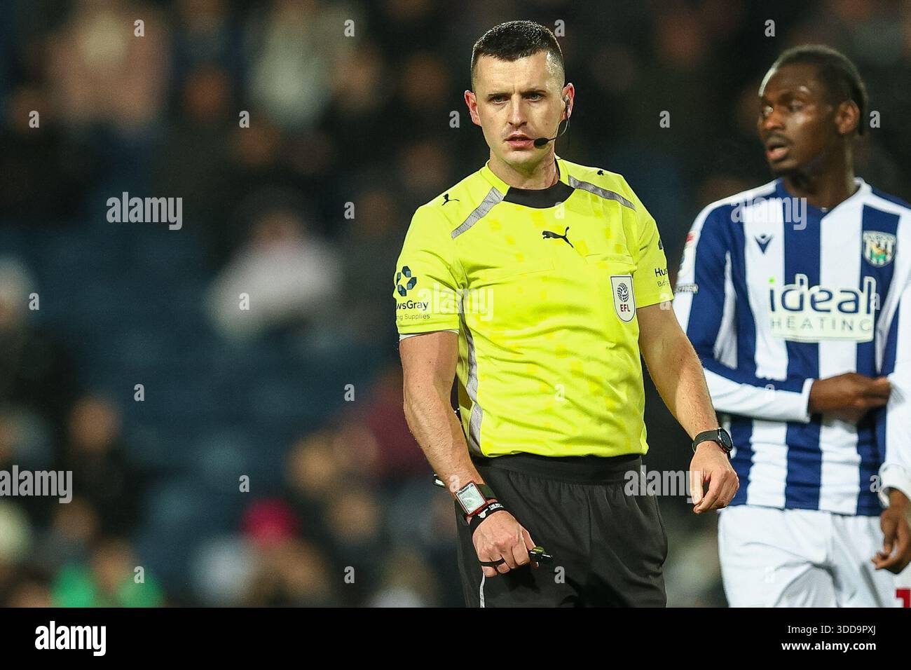 Referee, Lewis Smith watches play during the Sky Bet Championship match ...