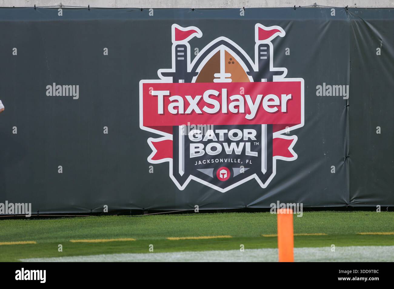 The TaxSlayer Gator Bowl logo is displayed on the field's interior wall ...