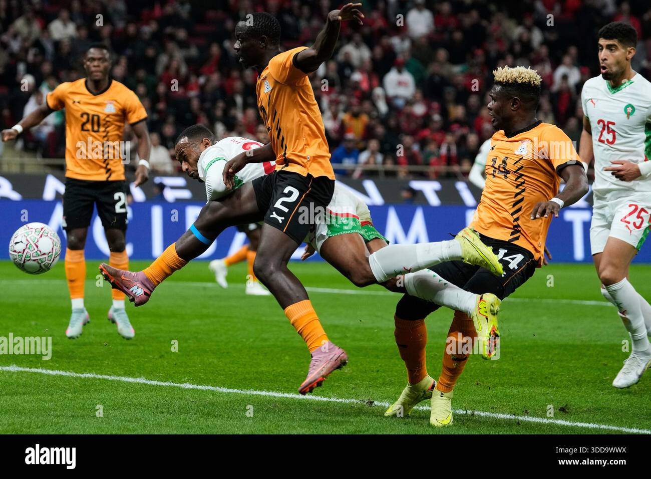 Morocco's Ayoub El Kaabi, center, dives as he scores his side first ...