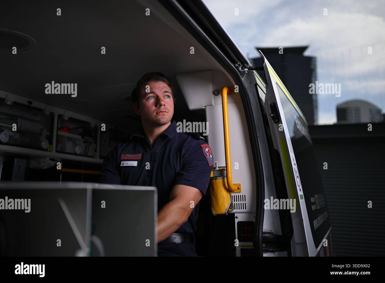 Ambulance Victoria paramedic Luke Harrington poses for a photograph in ...