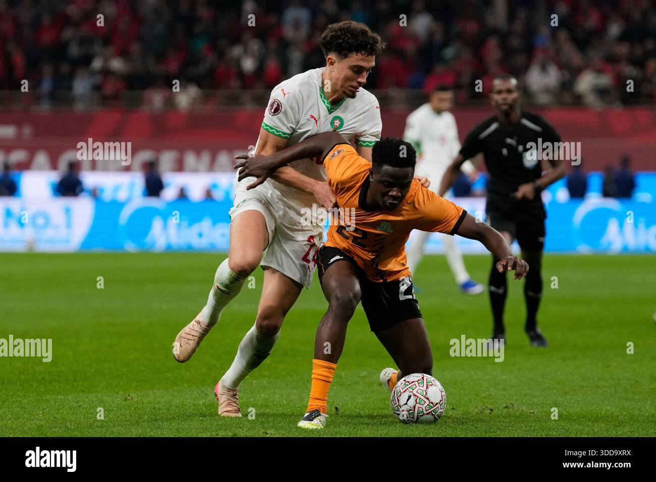 Morocco's Neil Yoni El Aynaoui, left, vies for the ball with Zambia's ...