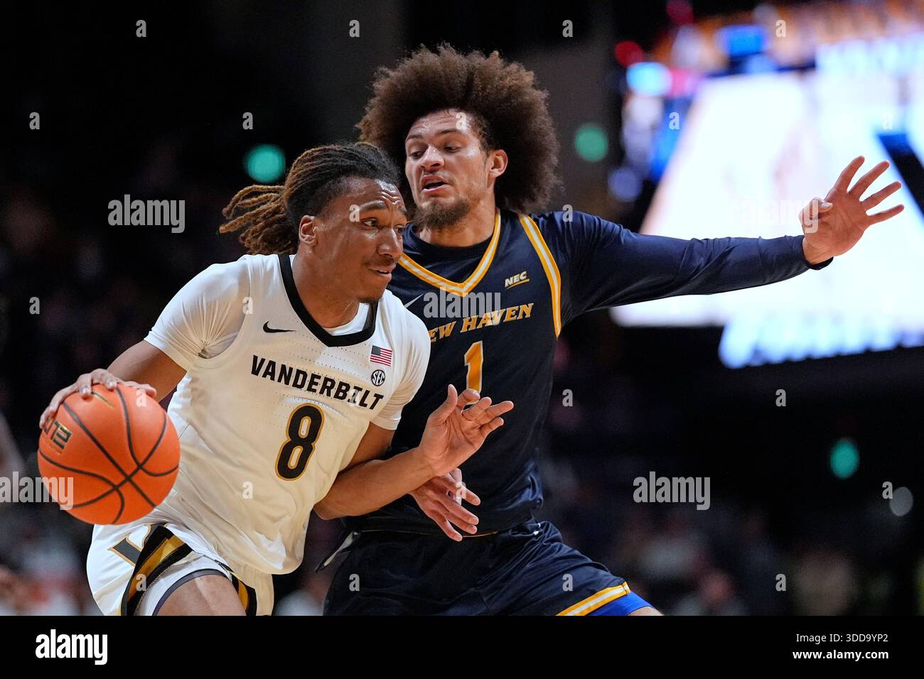 Vanderbilt guard Tyler Harris (8) dribbles the ball past New Haven ...