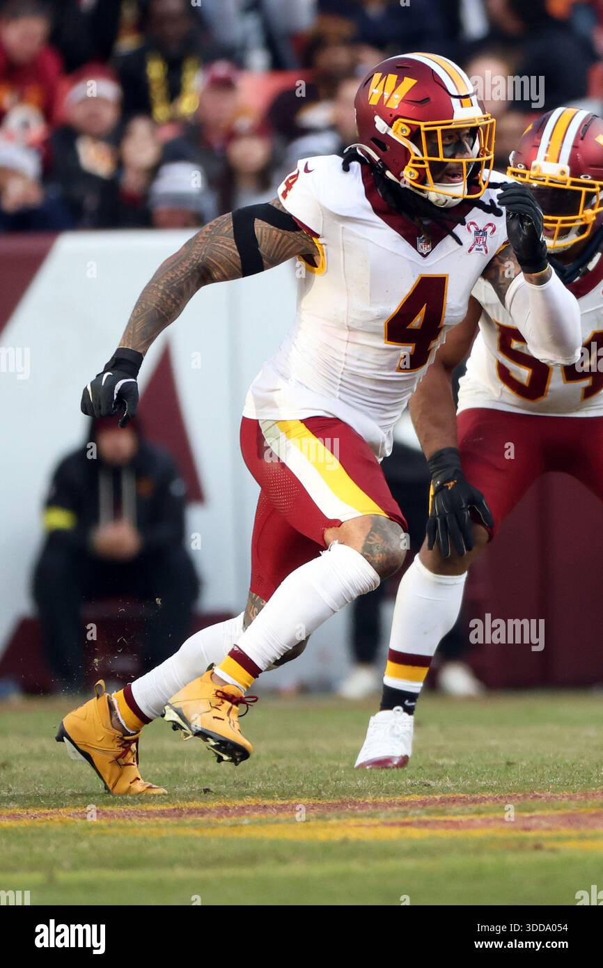 Washington Commanders linebacker Frankie Luvu (4) rushes during an NFL ...