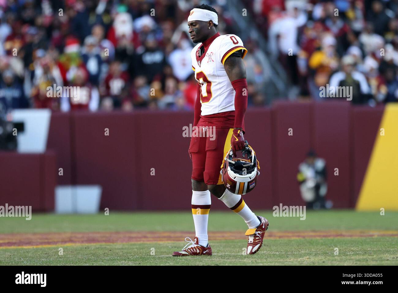 Washington Commanders cornerback Mike Sainristil (0) looks on during an ...