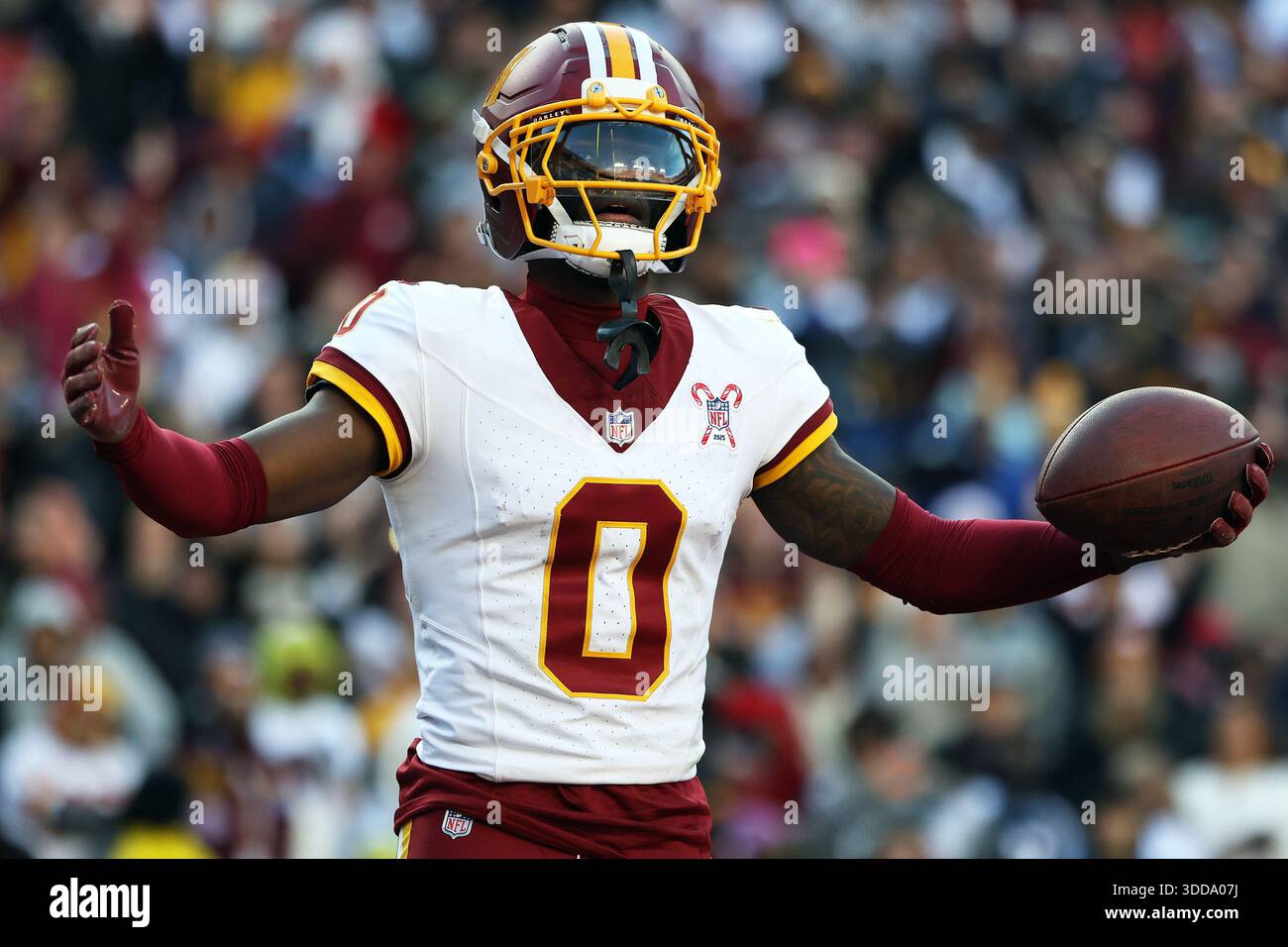 Washington Commanders cornerback Mike Sainristil (0) looks on during an ...