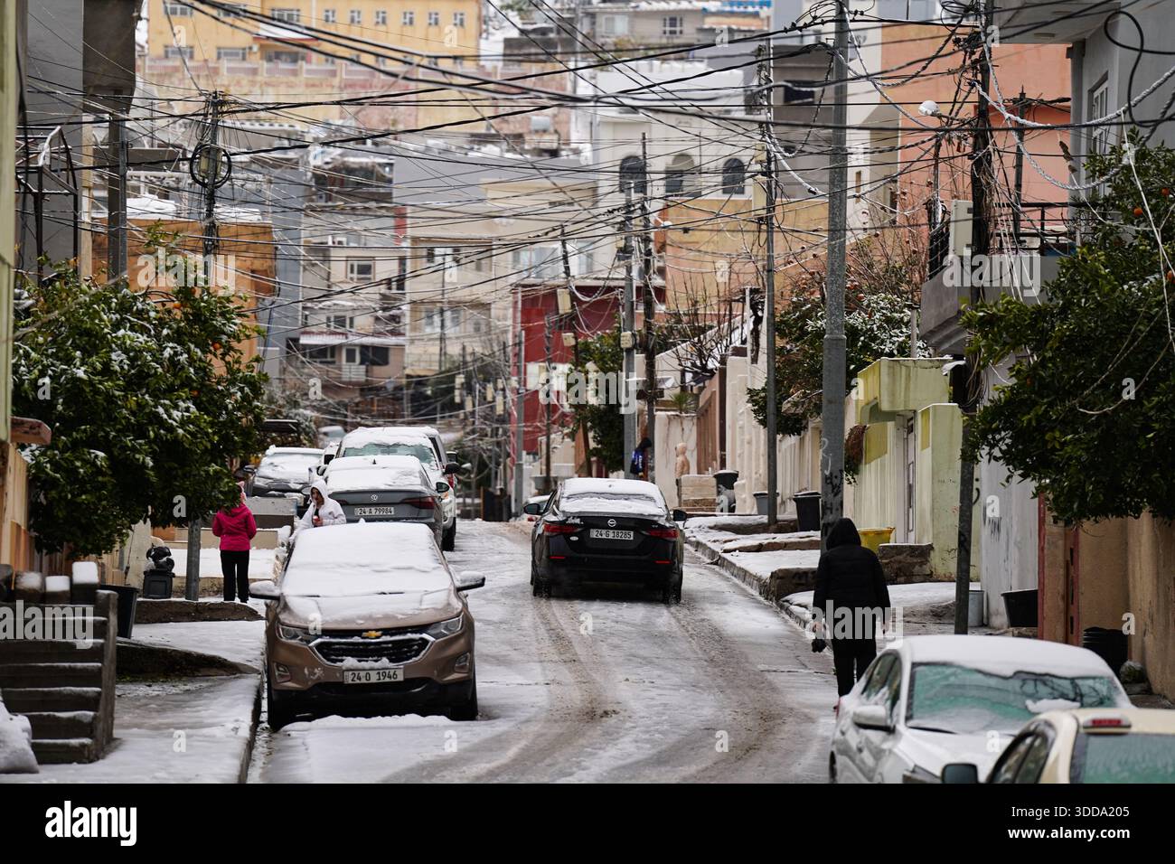A general view shows snow covering the street in the city of Duhok in ...