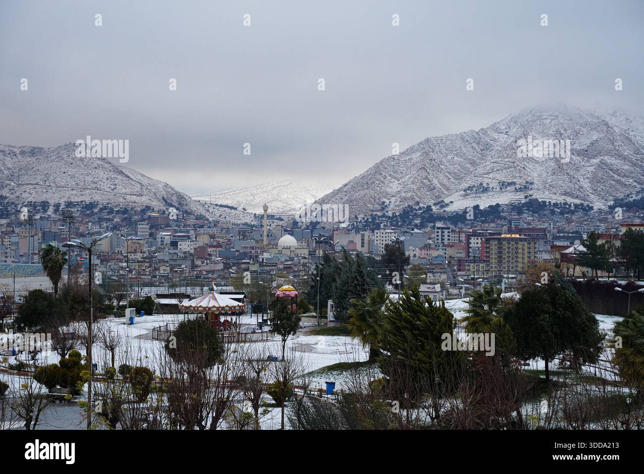 A general view shows snow covering the mountains surrounding the city ...