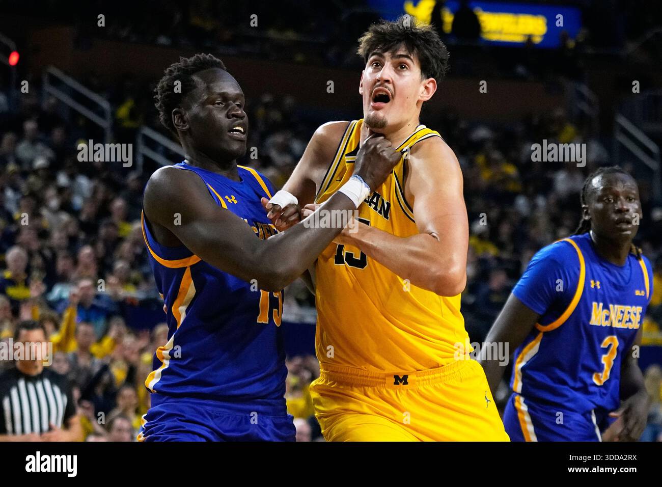 Michigan center Aday Mara, right, and McNeese forward Peitok MacHar vie ...